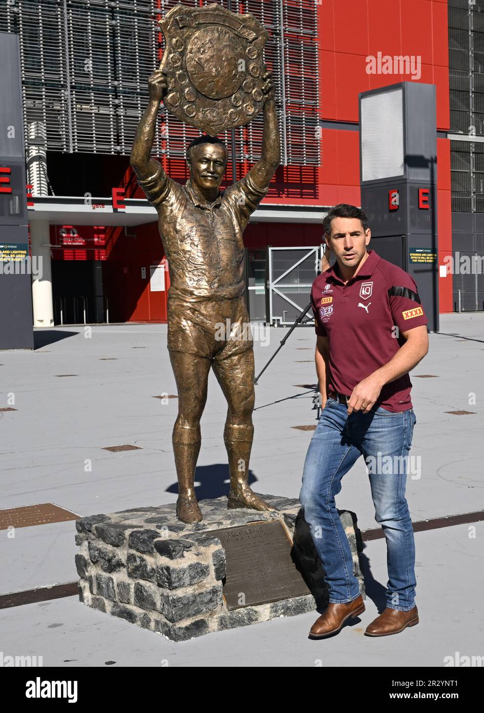 Queensland coach Billy Slater walks past the statue of Wally Lewis ...