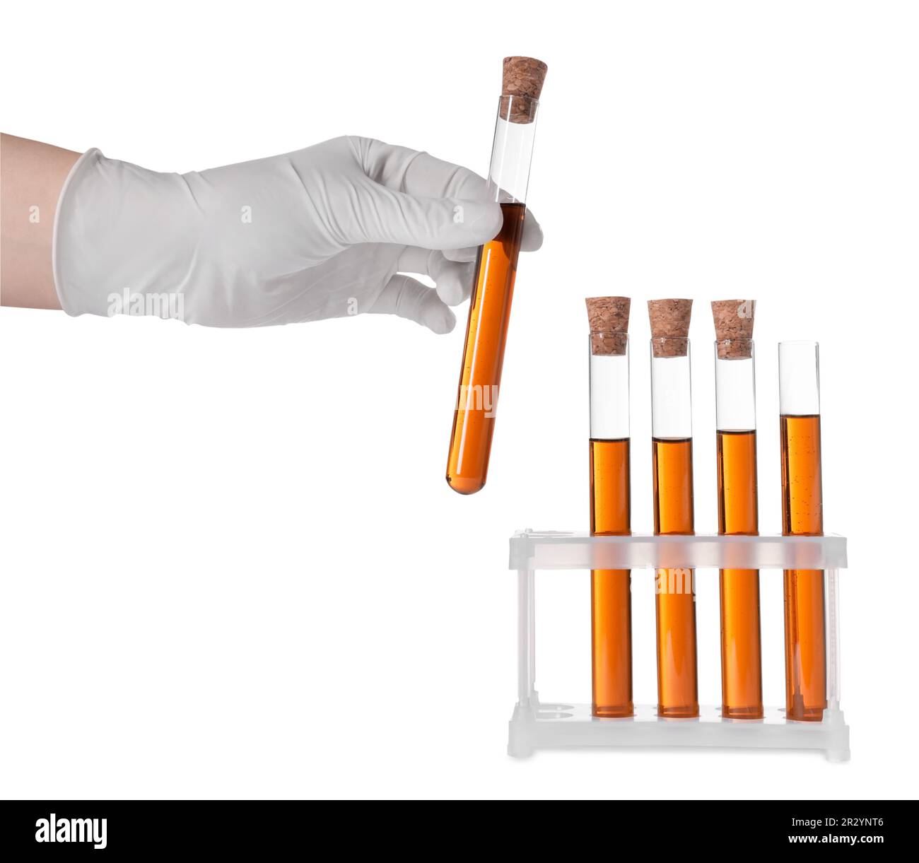 Scientist holding test tube with brown liquid on white background ...