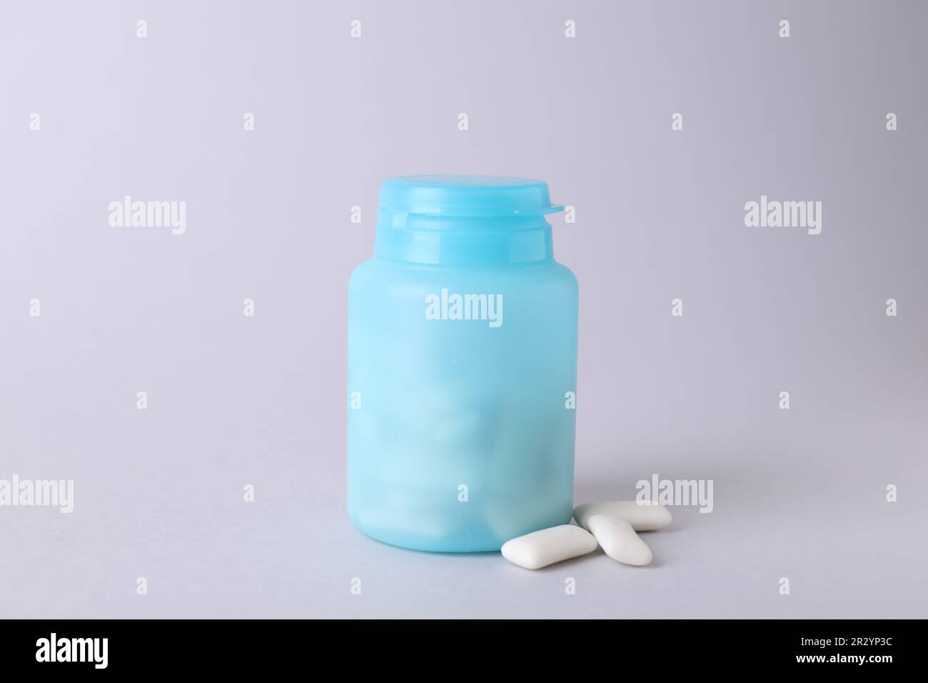 Jar with chewing gums on light grey background Stock Photo - Alamy