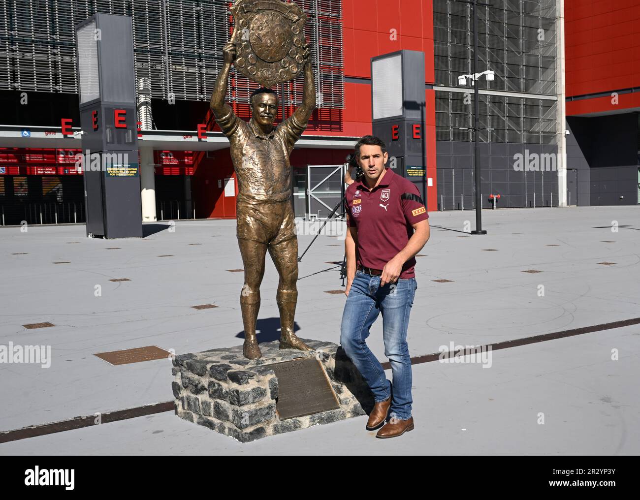 Queensland coach Billy Slater walks past the statue of Wally Lewis ...