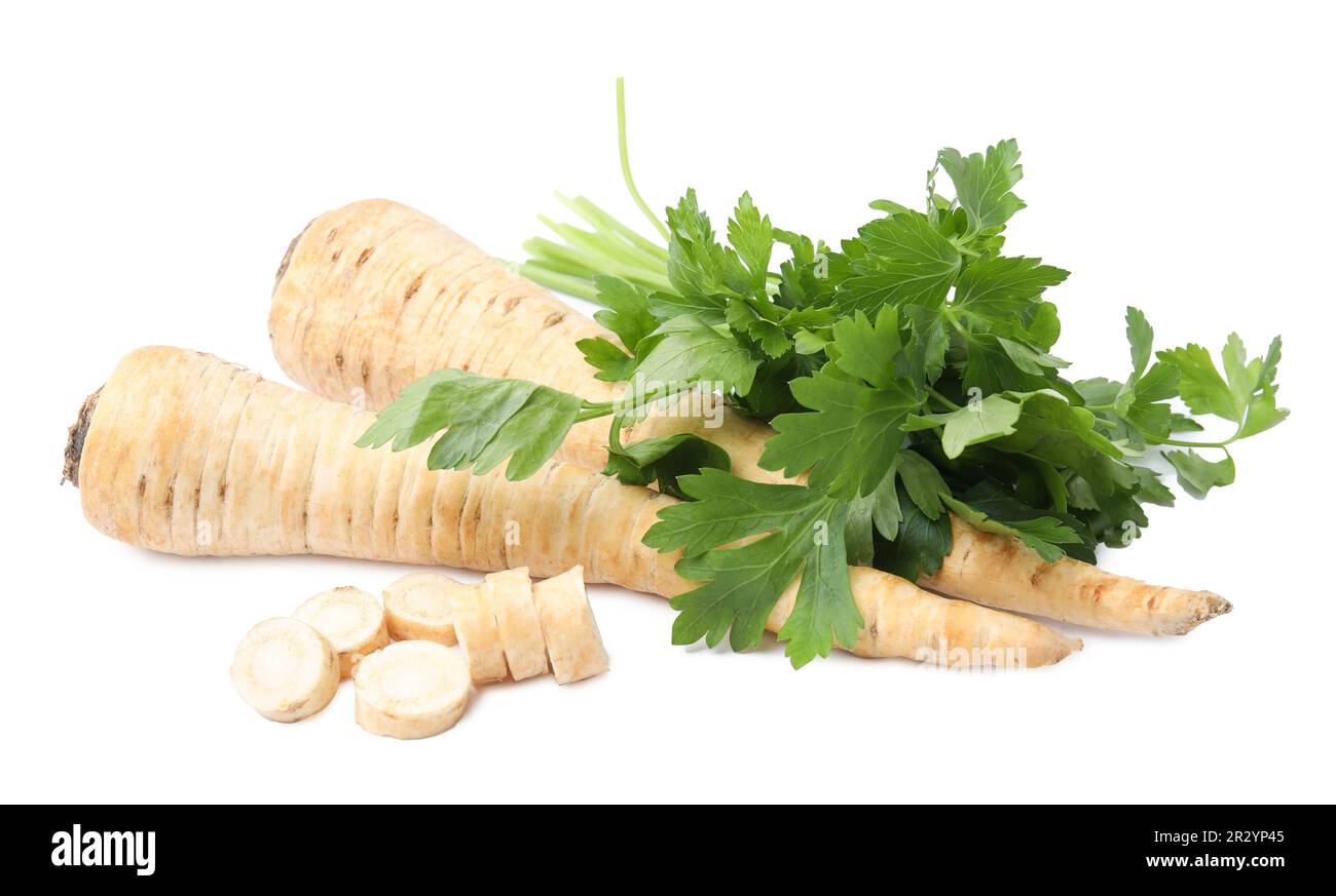 Raw parsley roots and bunch of fresh herb isolated on white Stock Photo ...