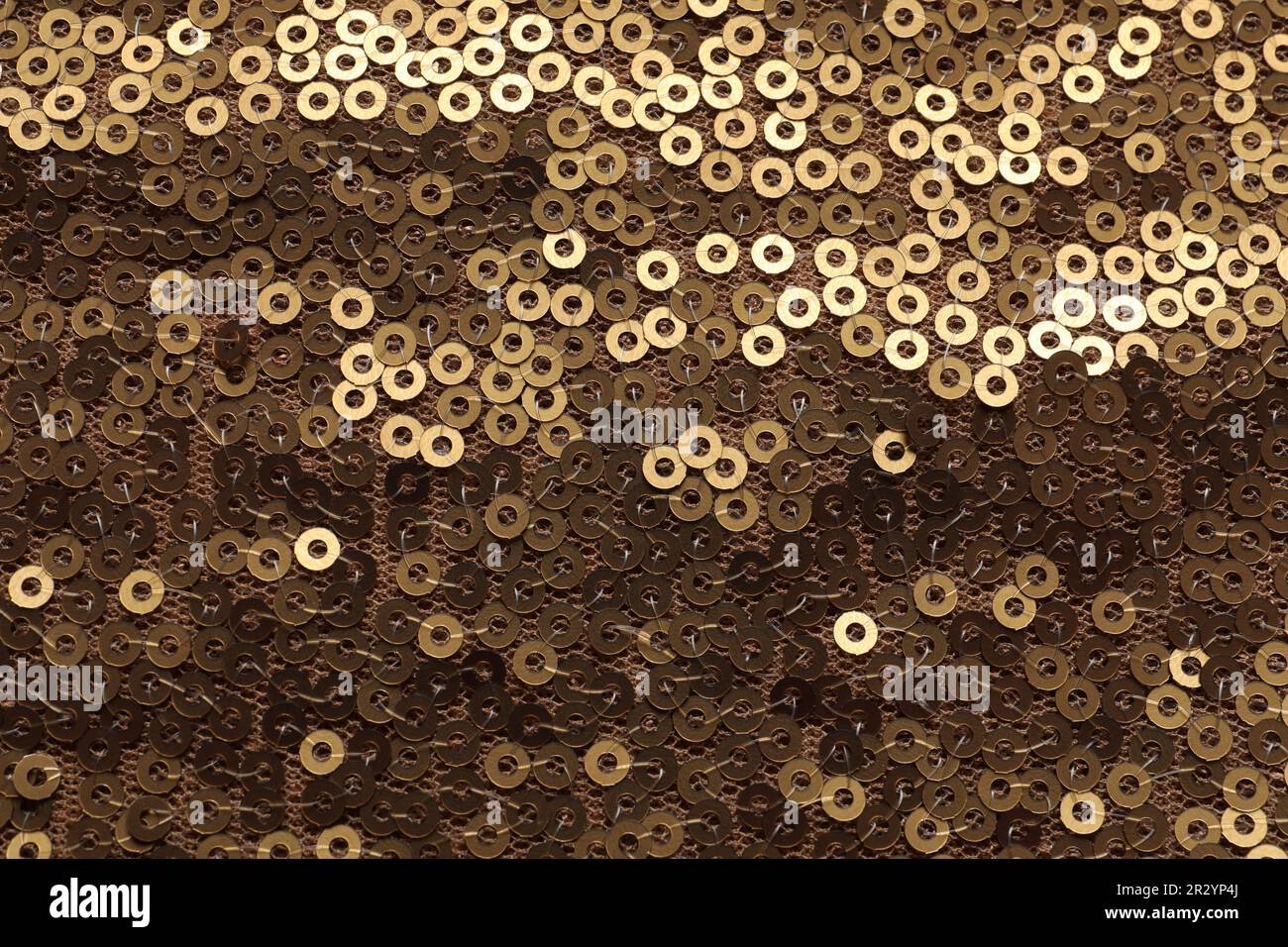 Beautiful golden sequin fabric as background, top view Stock Photo - Alamy