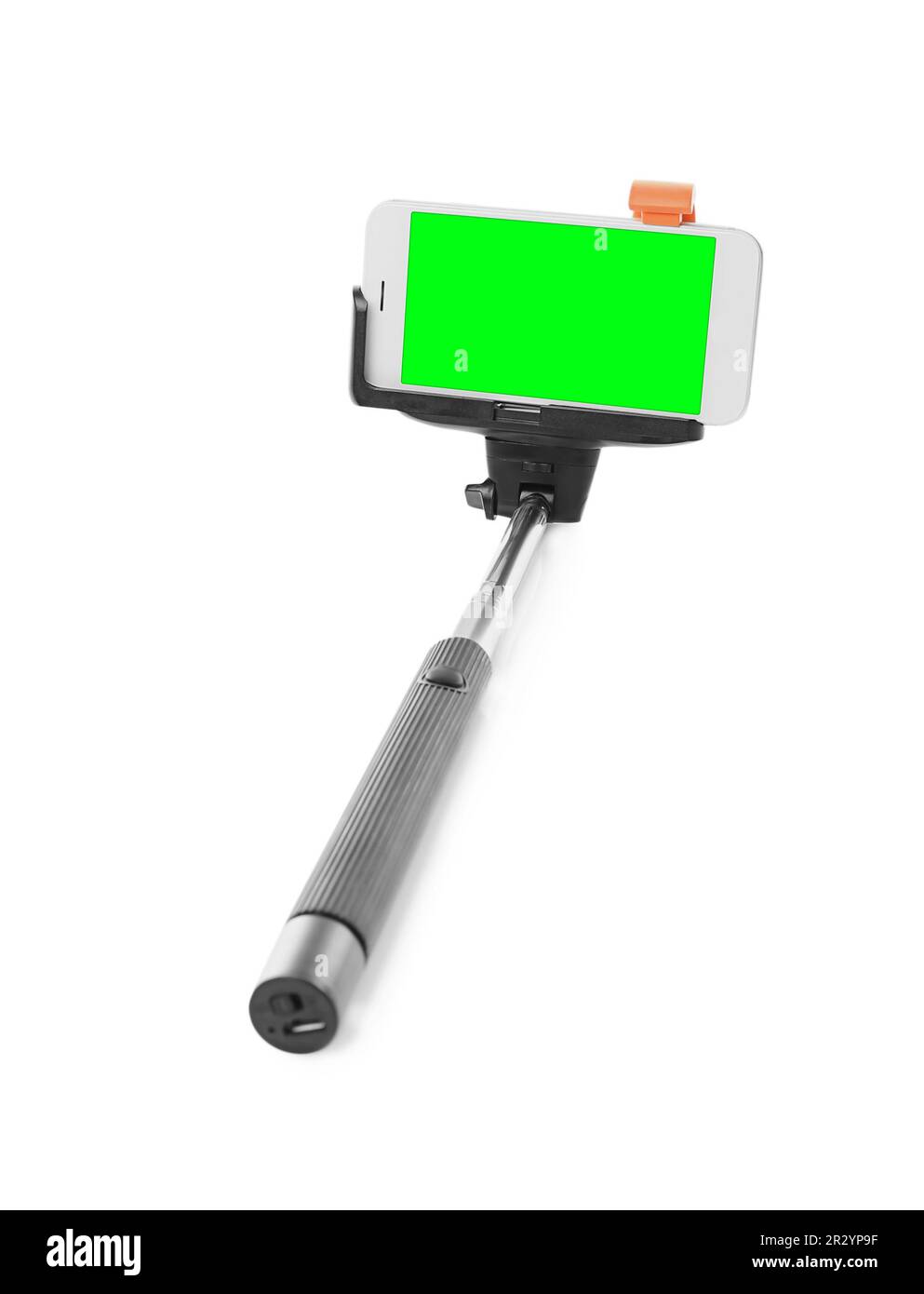 Selfie stick and smartphone with green screen on white background ...