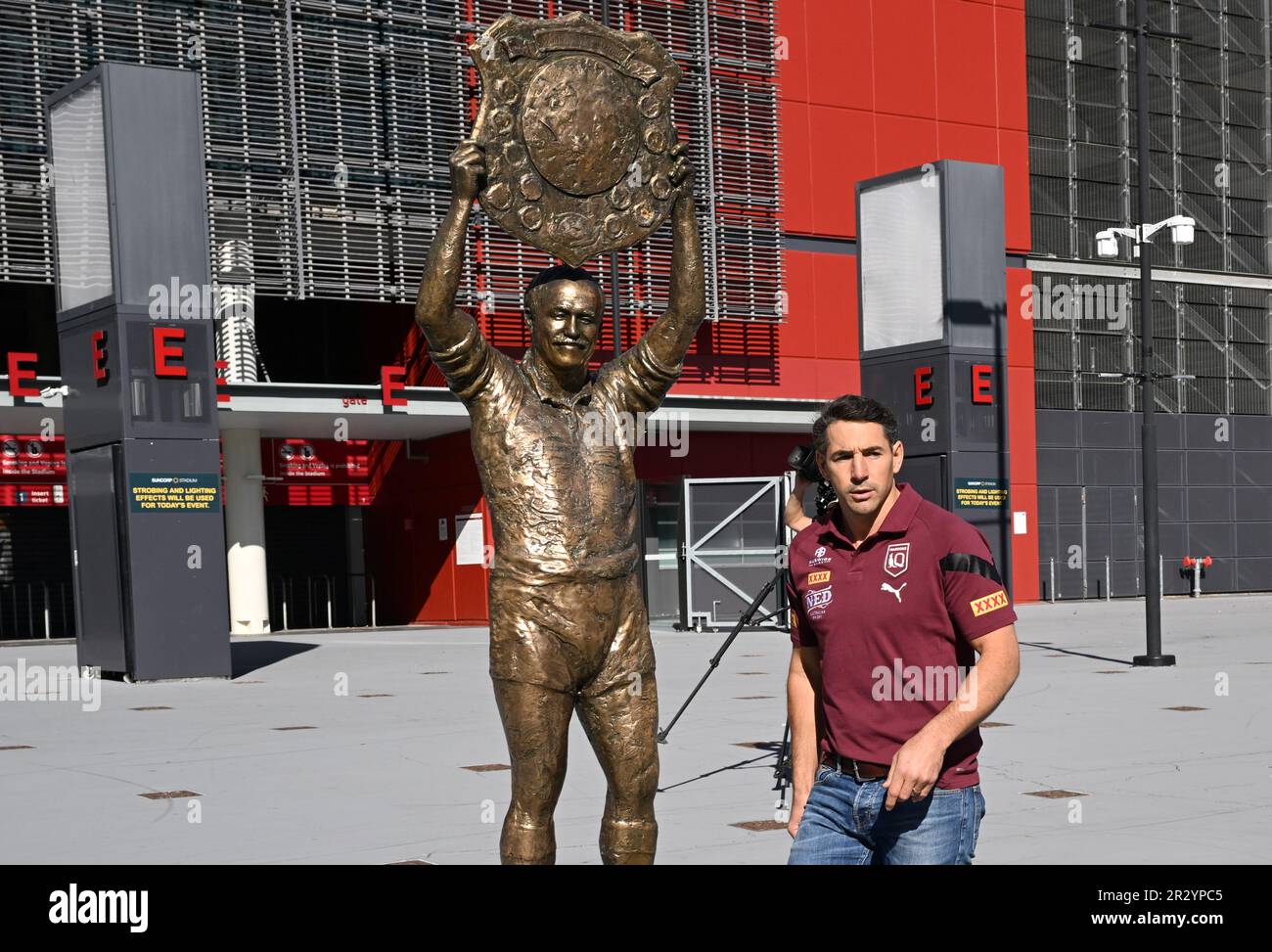 Queensland coach Billy Slater walks past the statue of Wally Lewis ...