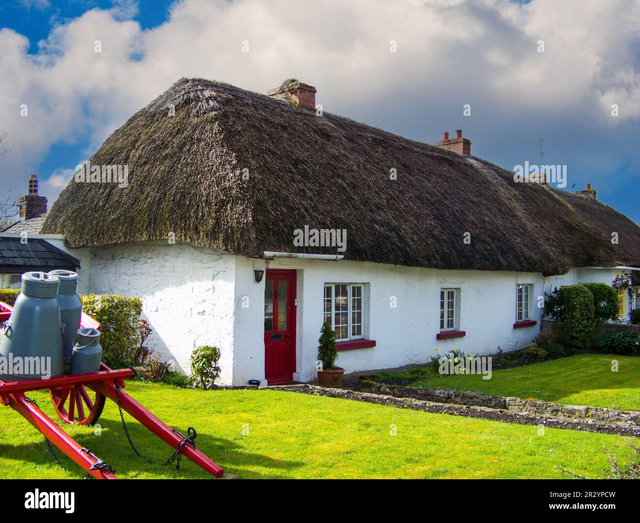 Thatched Roof Cottage with a red door in Adare Ireland Stock Photo - Alamy