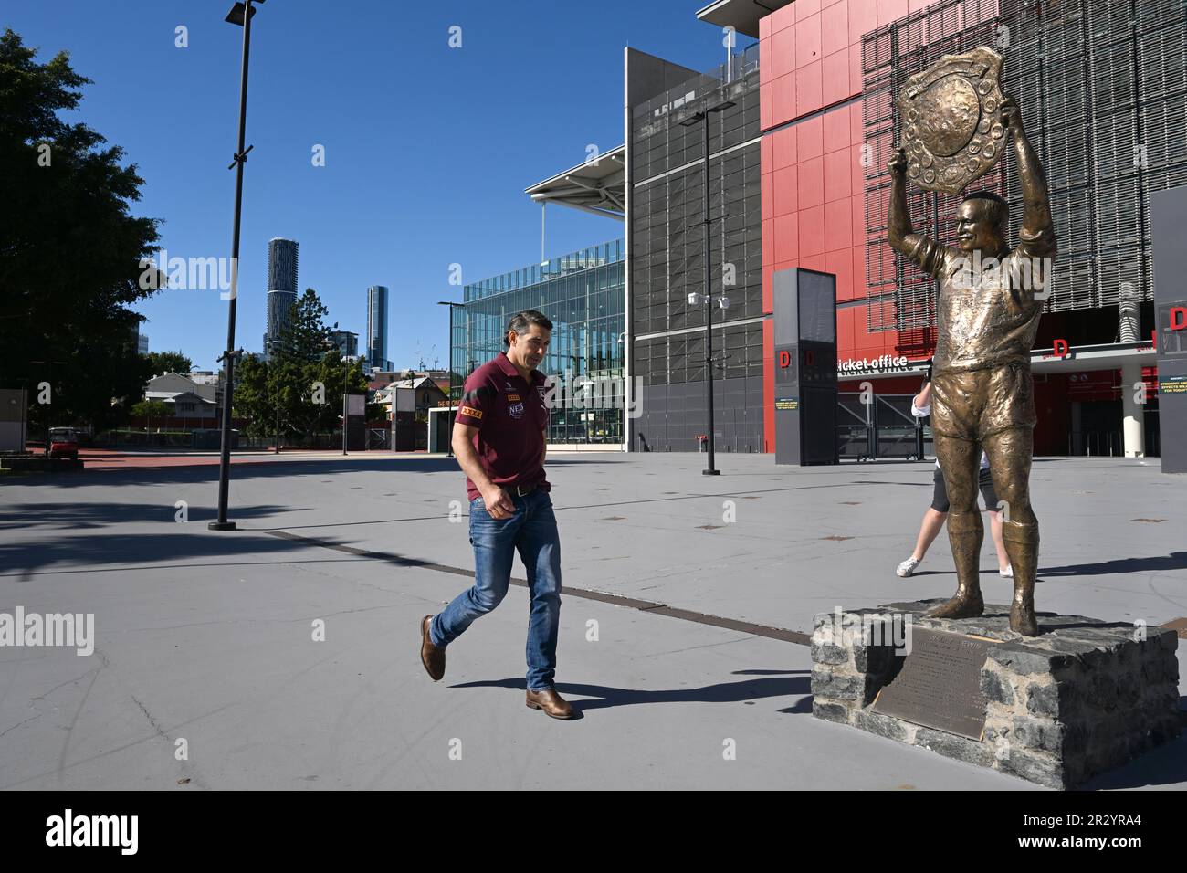 Queensland coach Billy Slater walks past the statue of Wally Lewis ...