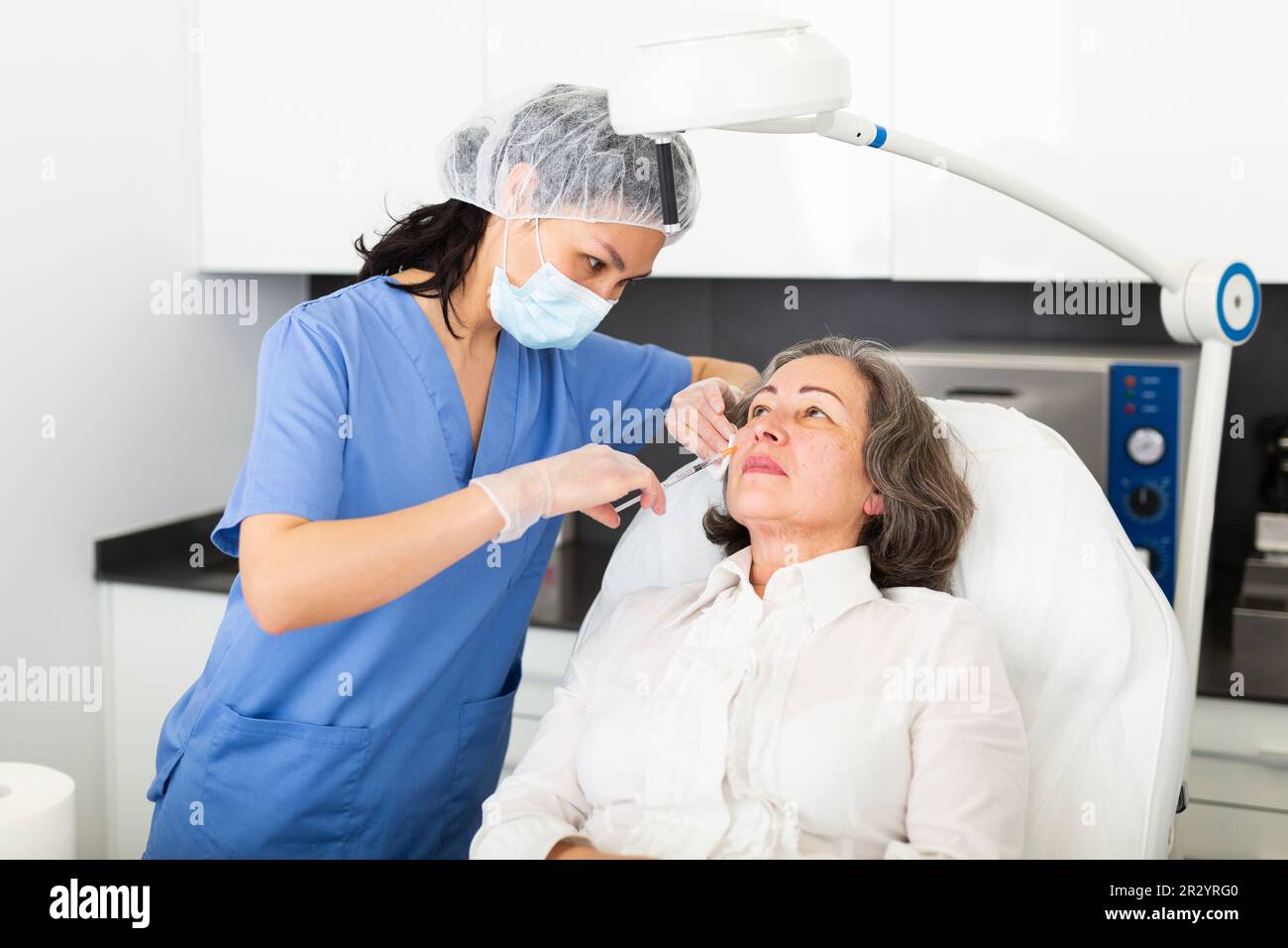 Mature woman getting ready for plastic surgery closeup Stock Photo - Alamy