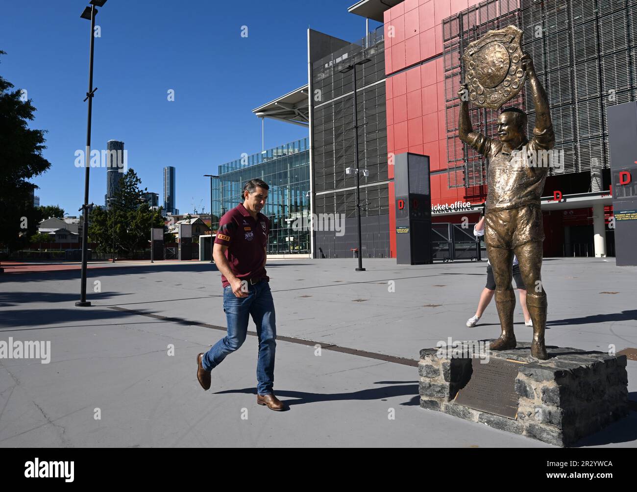 Queensland coach Billy Slater walks past the statue of Wally Lewis ...