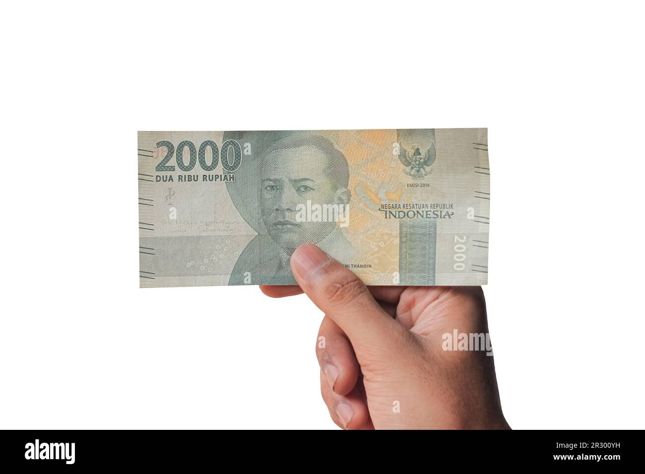 hand holding two thousand rupiah isolated on white background Stock ...