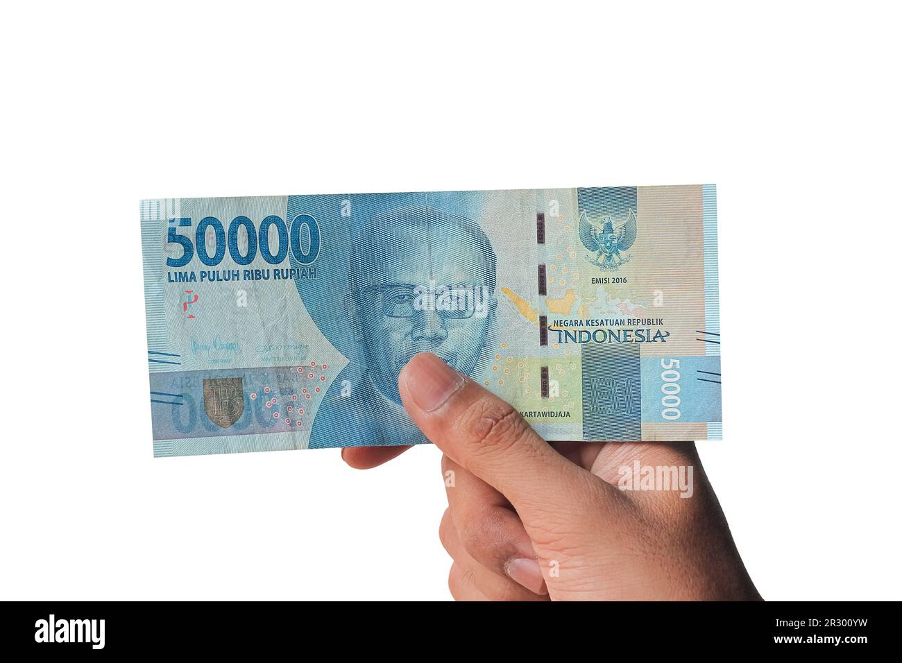 man's hand showing 50,000 thousand rupiah isolated on white background ...