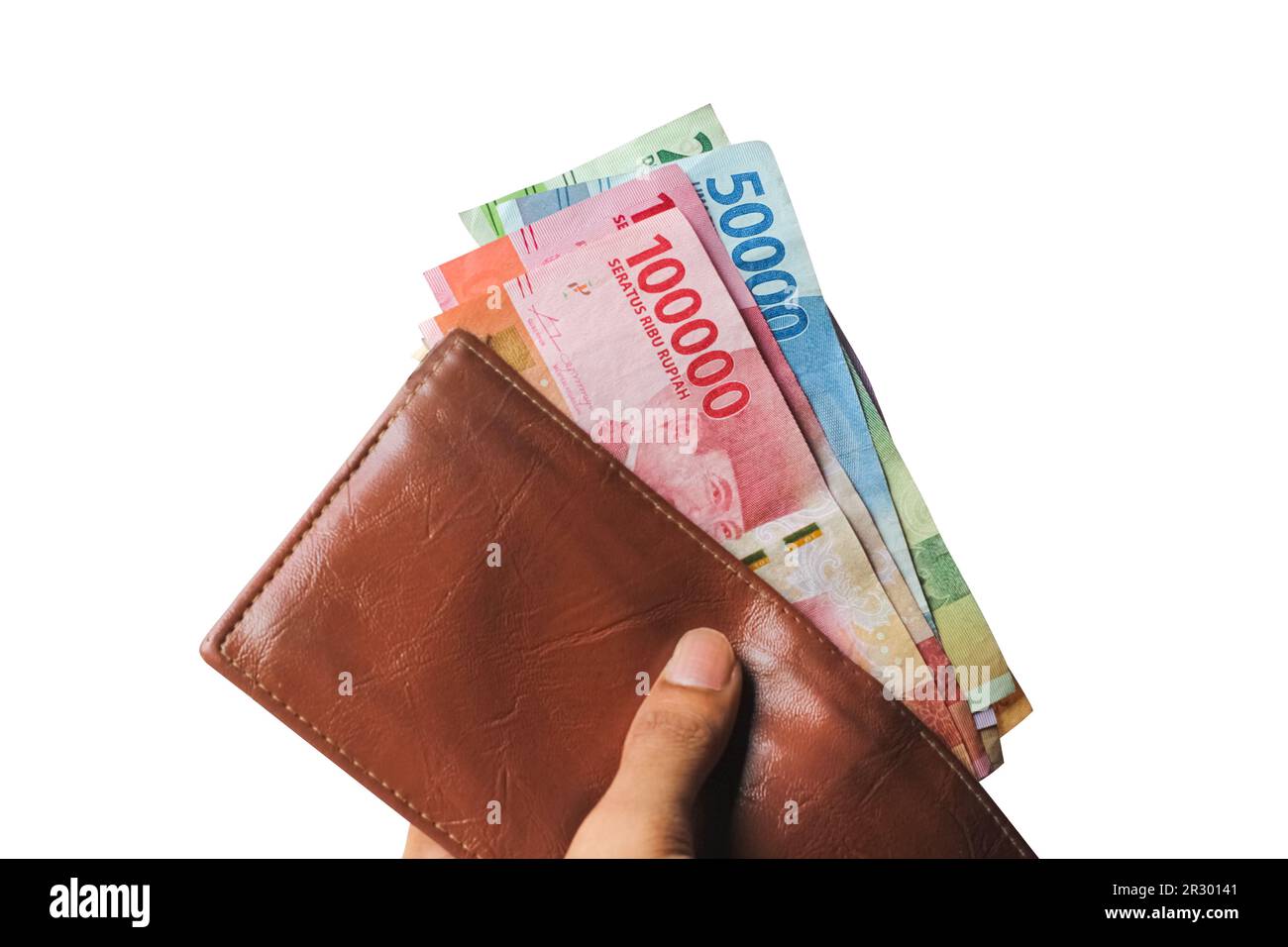 Hand showing rupiah money from wallet isolated on white background ...
