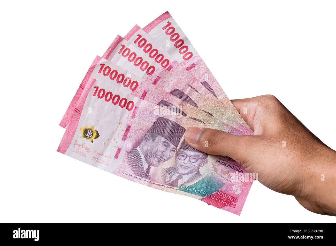 hand holding IDR 100,000 rupiah note isolated on white background ...