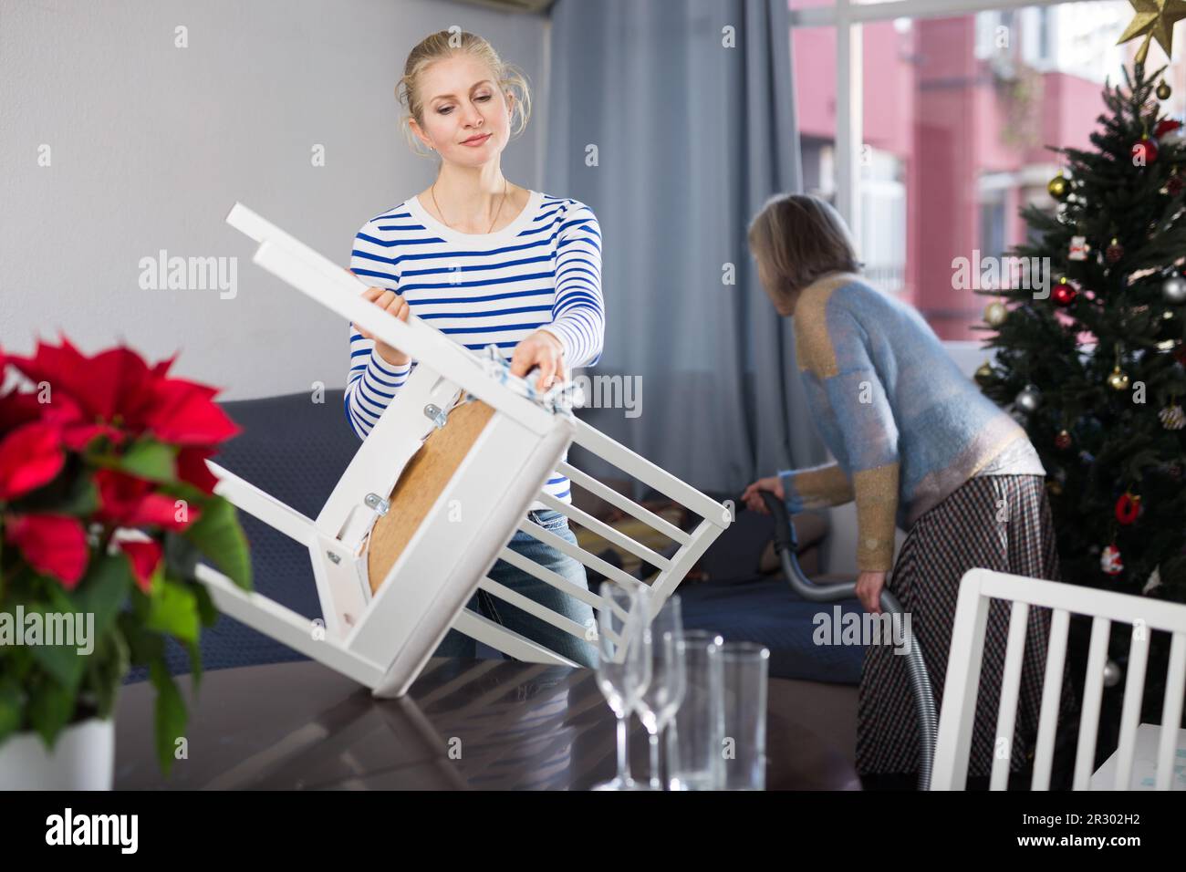 Adult daughter and her mature mother clean the flat Stock Photo - Alamy