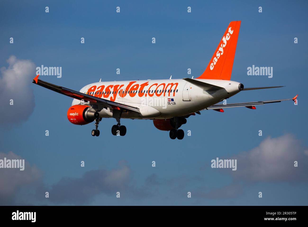 Airline EasyJet plane comes in for a landing in an aeroport El Prat ...