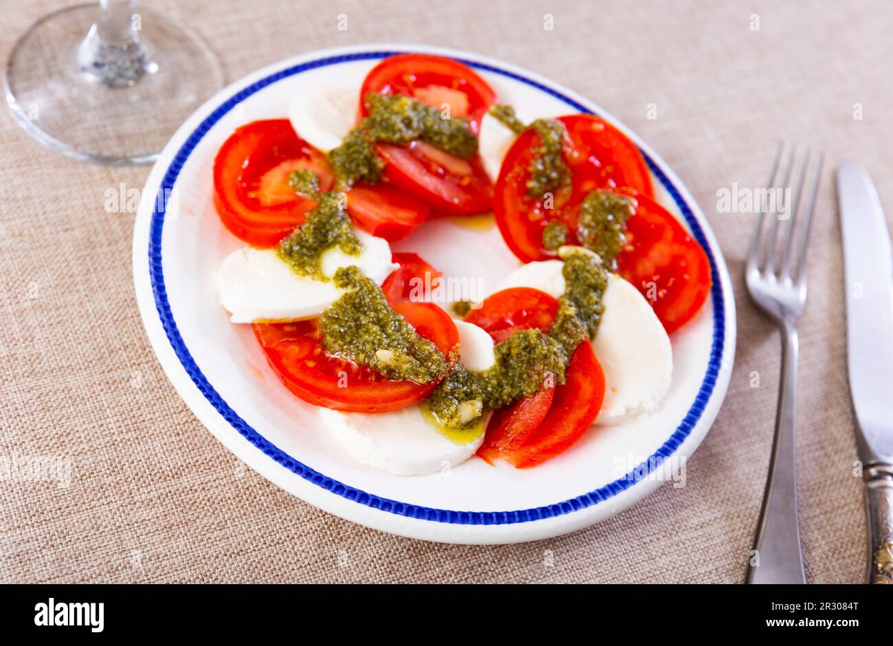 Caprese salad with tomato, mozzarella and balsamic dressing Stock Photo ...