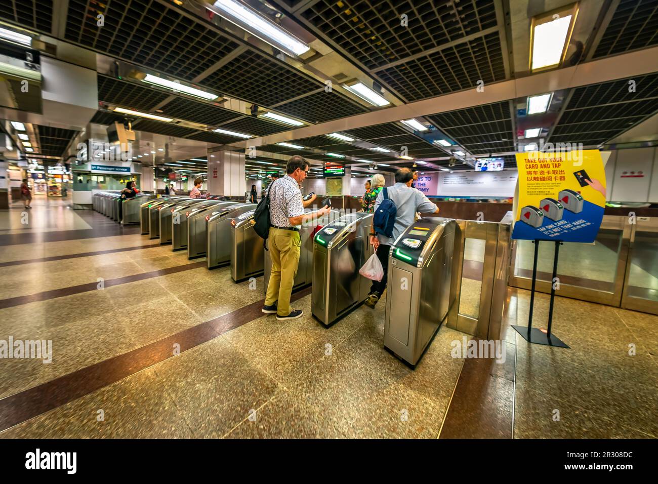 Passengers checking in at Automatic Fare Collection Gates at City Hall ...