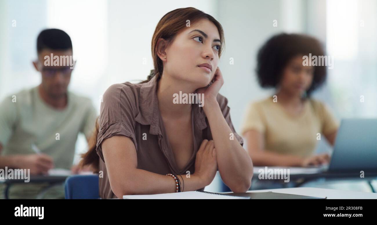 Education, depression and girl university student in a classroom bored ...
