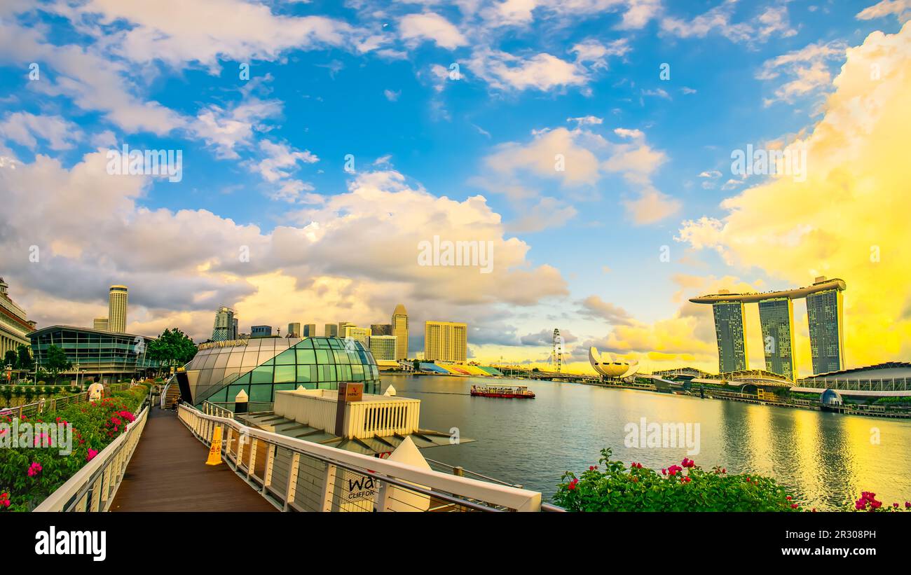 Bum boat cruising along Singapore river at Marina Bay during sunset ...