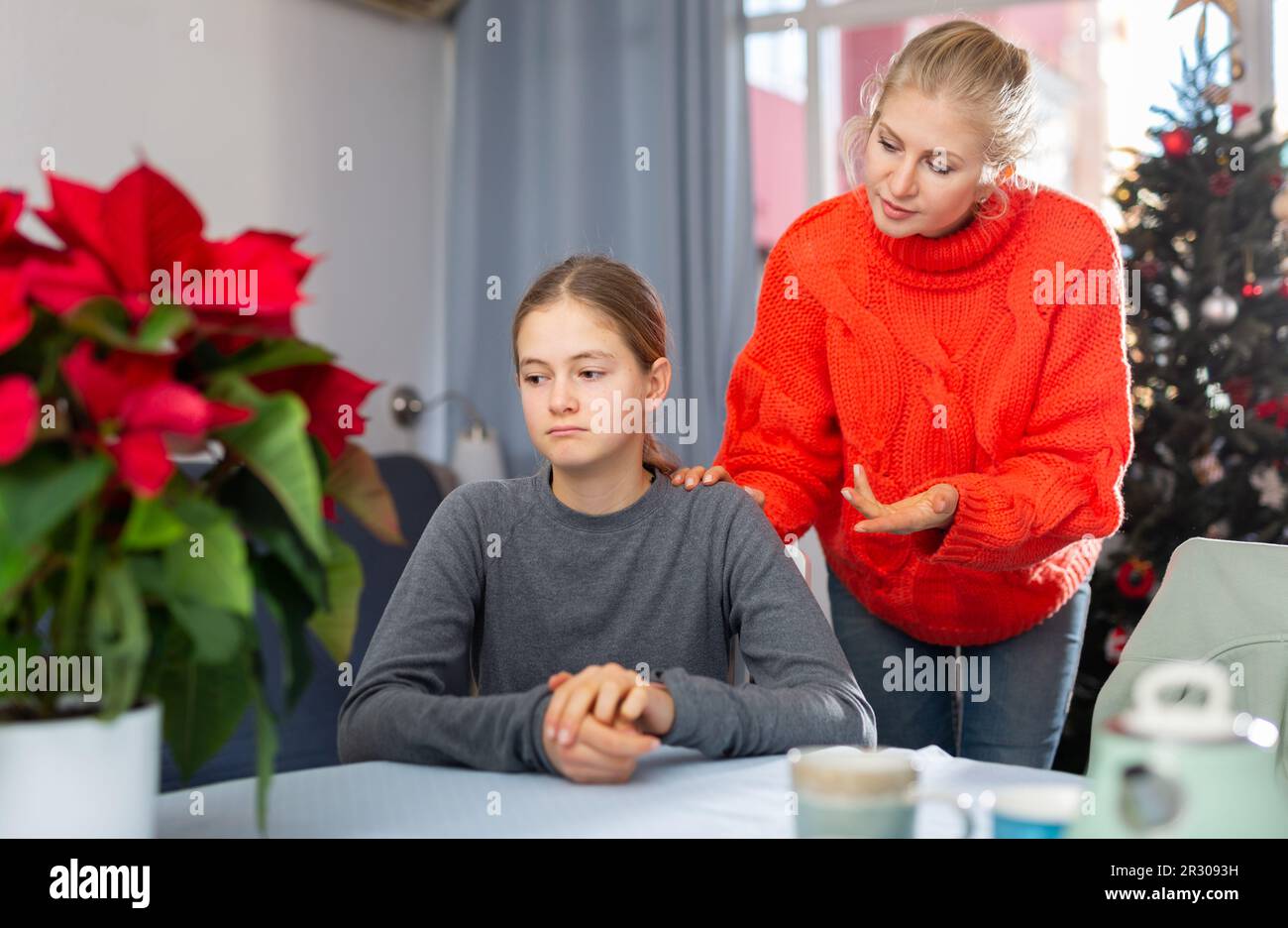 Teenage girl ignoring her mother before Christmas Stock Photo - Alamy