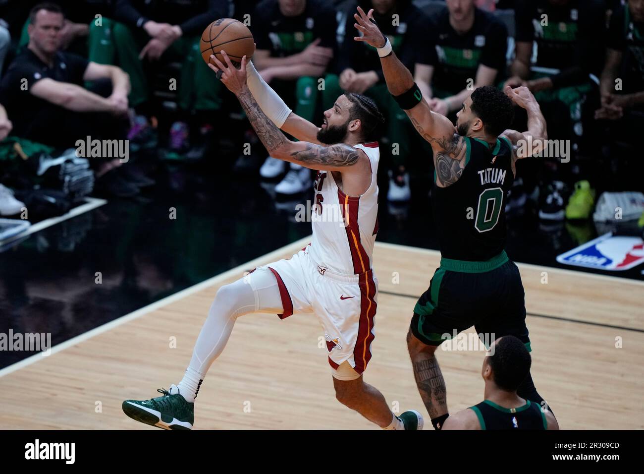 Boston Celtics forward Jayson Tatum (0) defends Miami Heat forward ...