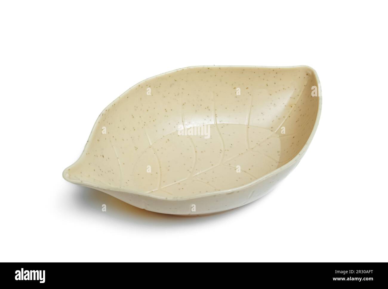 a serving bowl in the shape of a leaf isolated on white background ...
