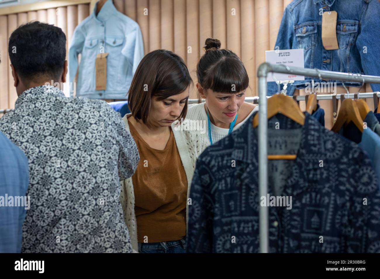 Potential customers browse around a stall at the Bangladesh Denim Expo ...