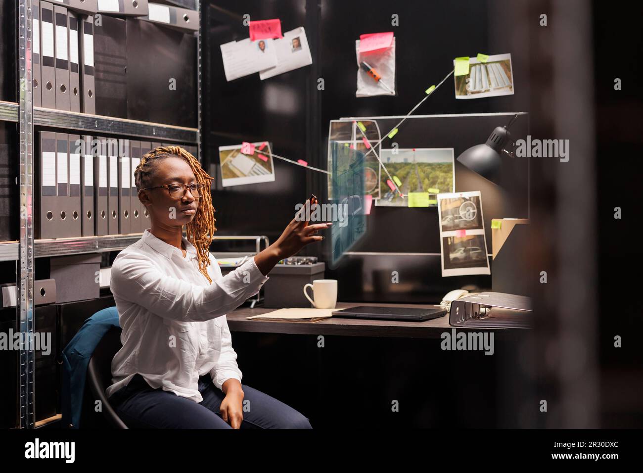African american woman examining evidence hi-res stock photography and images - Alamy