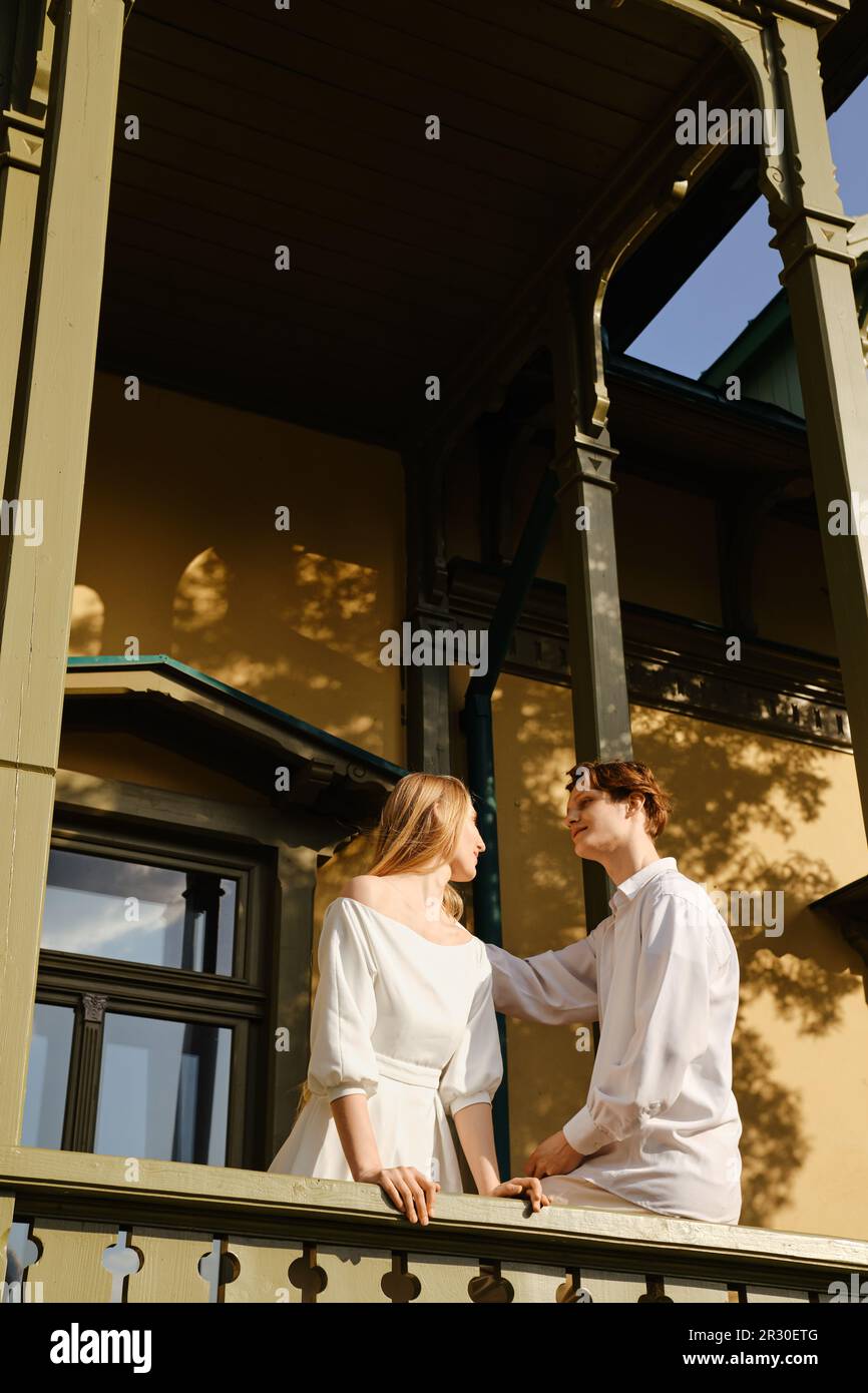 Lovely woman standing on balcony hi-res stock photography and images ...