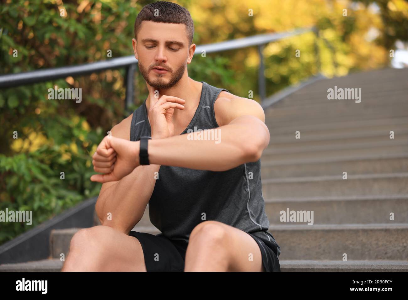 Attractive man checking pulse hi-res stock photography and images - Alamy