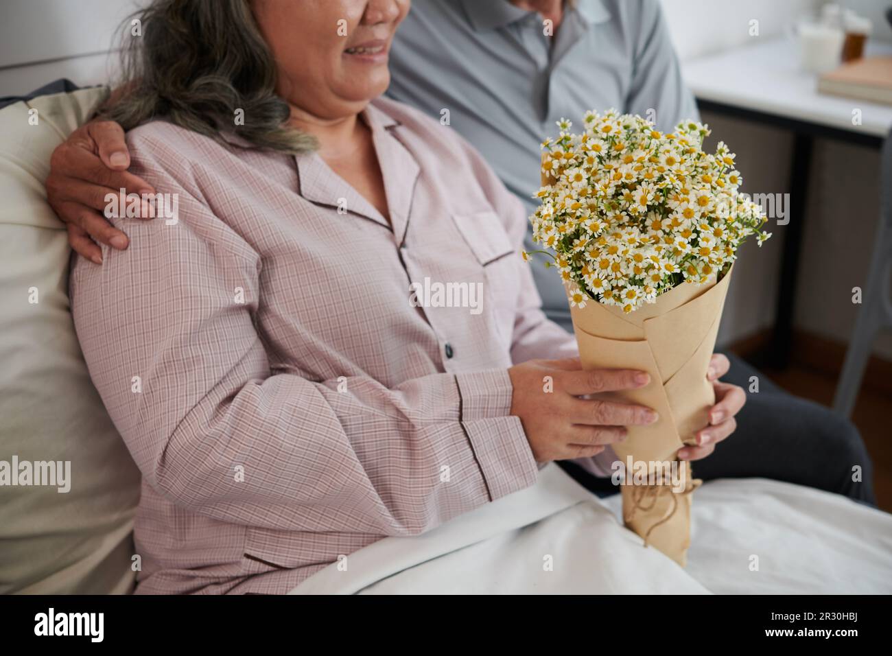 Hospital visit elderly flowers hi-res stock photography and images - Alamy