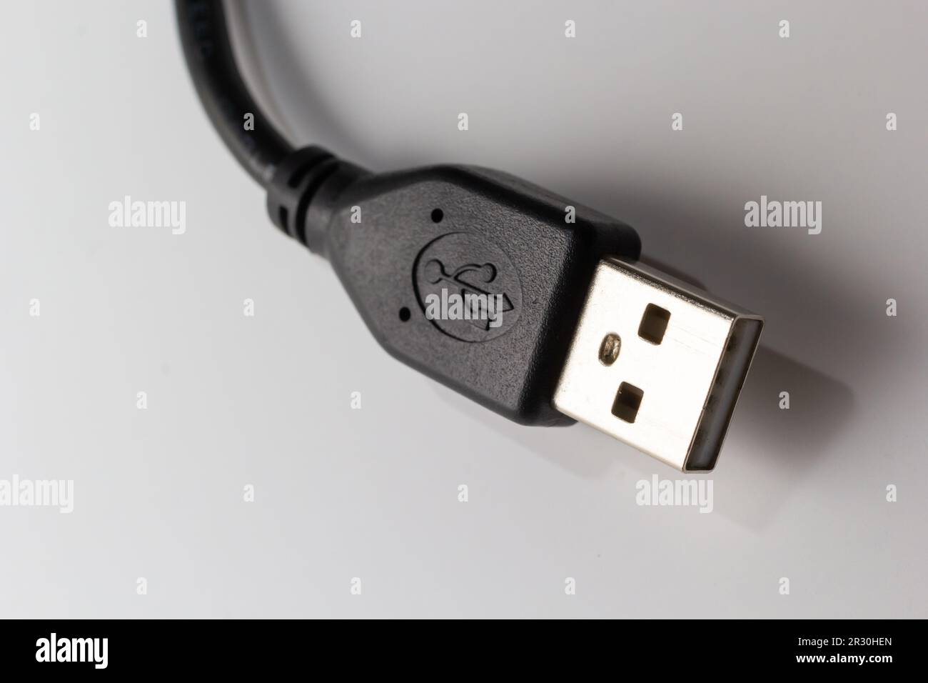Close up of USB cable on white background. Data transfer technologies ...