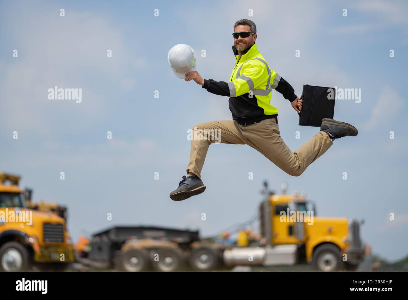 Construction builder excited jump hi-res stock photography and images ...