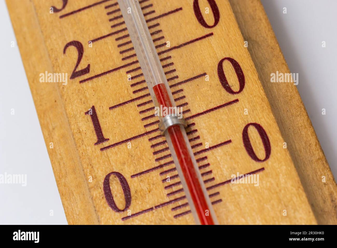 room thermometer on a wooden base close up on a white background ...