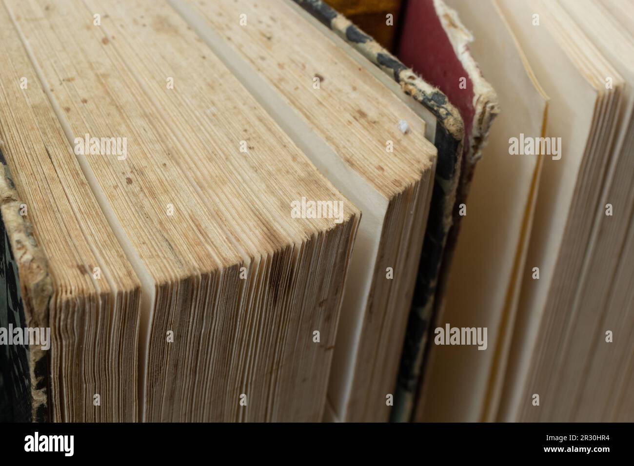 Book background. Stack of books in the library. Old yellow pages of ...