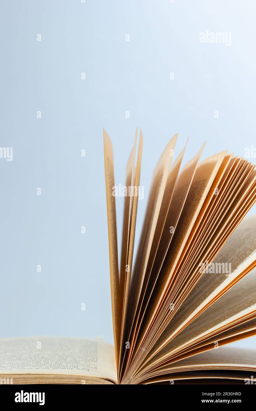 Open old book with text on white background. The concept of reading ...