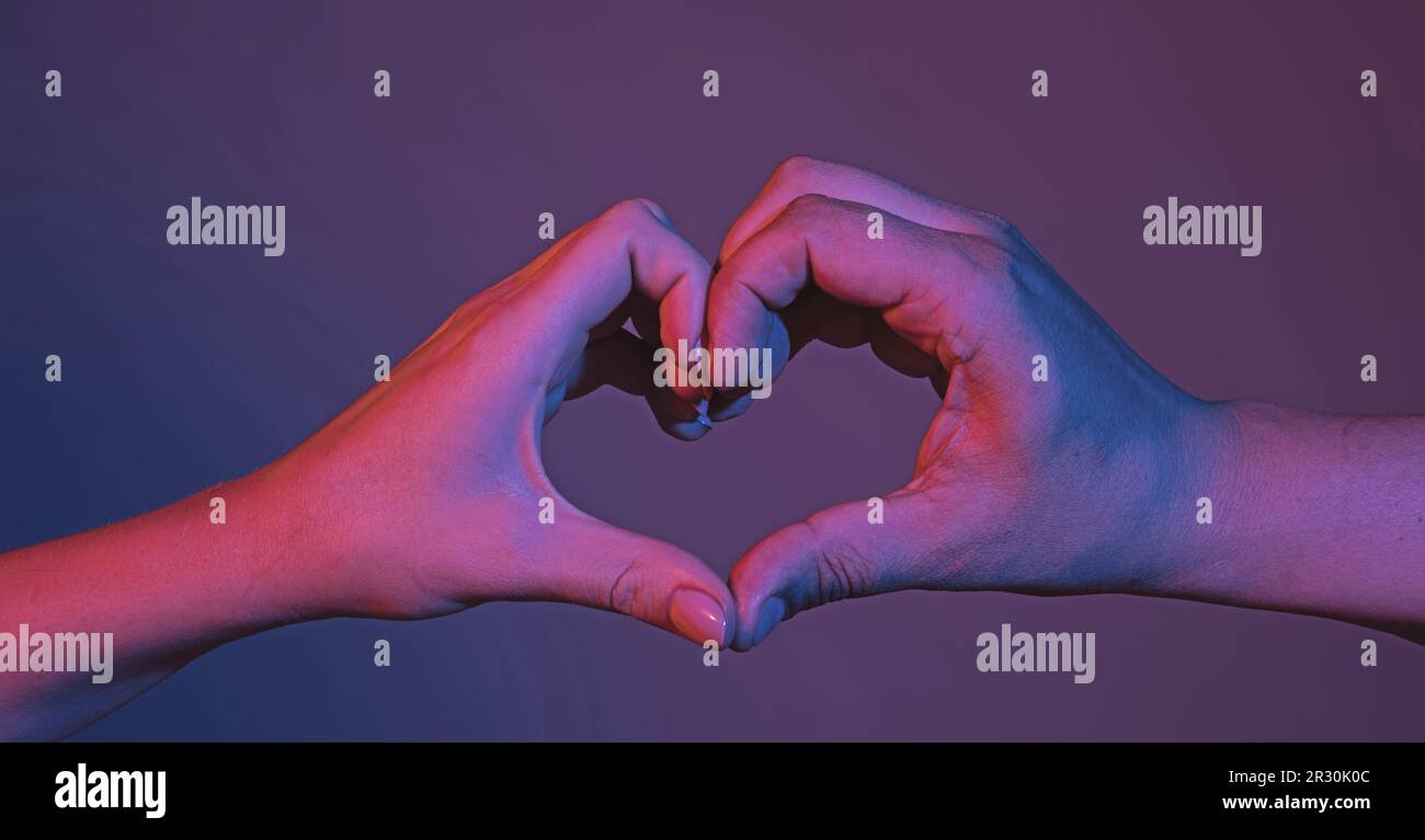 Female and male hands in form of heart. Hands in shape of love heart ...