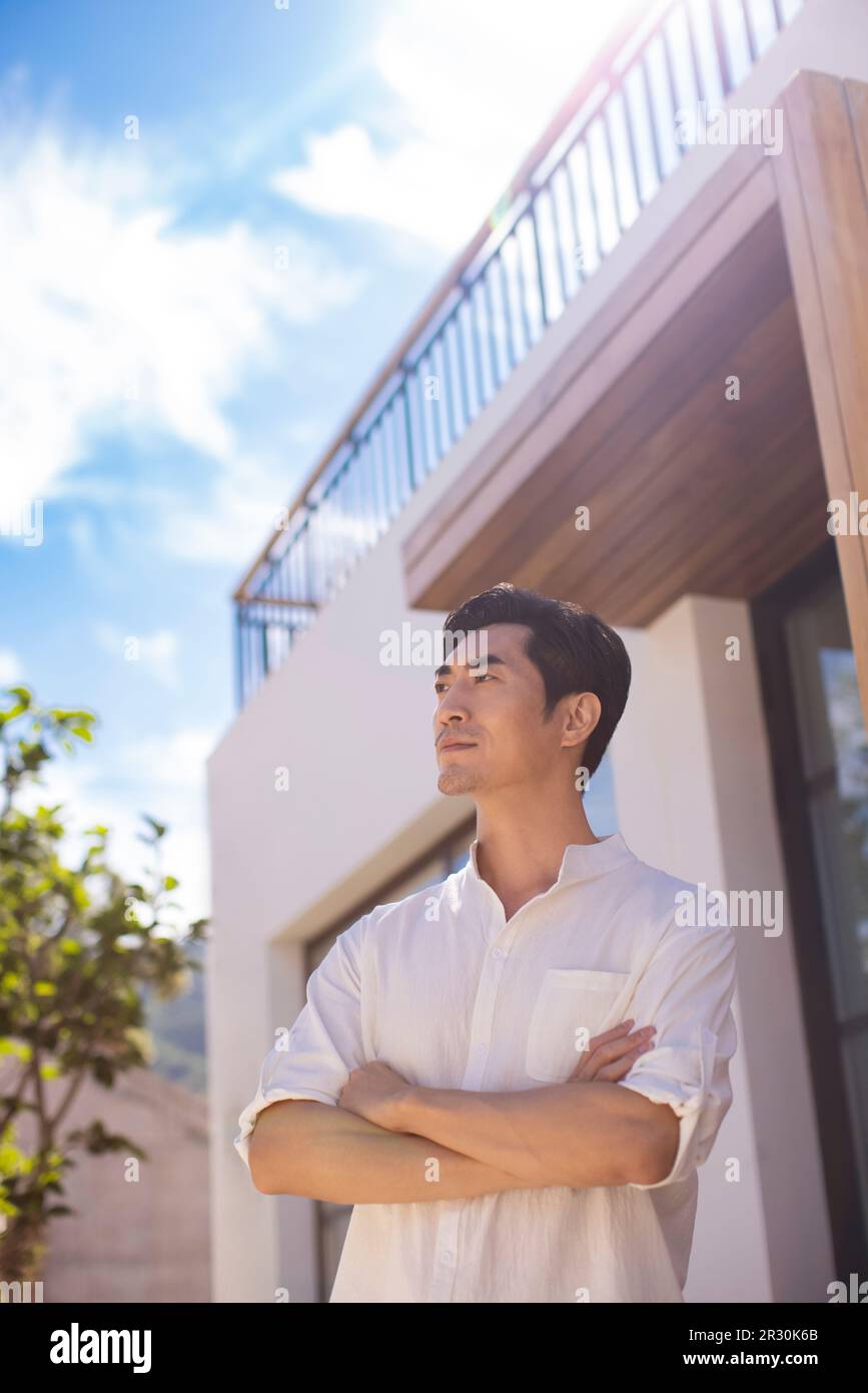 Happy mid adult Chinese man on vacation Stock Photo - Alamy