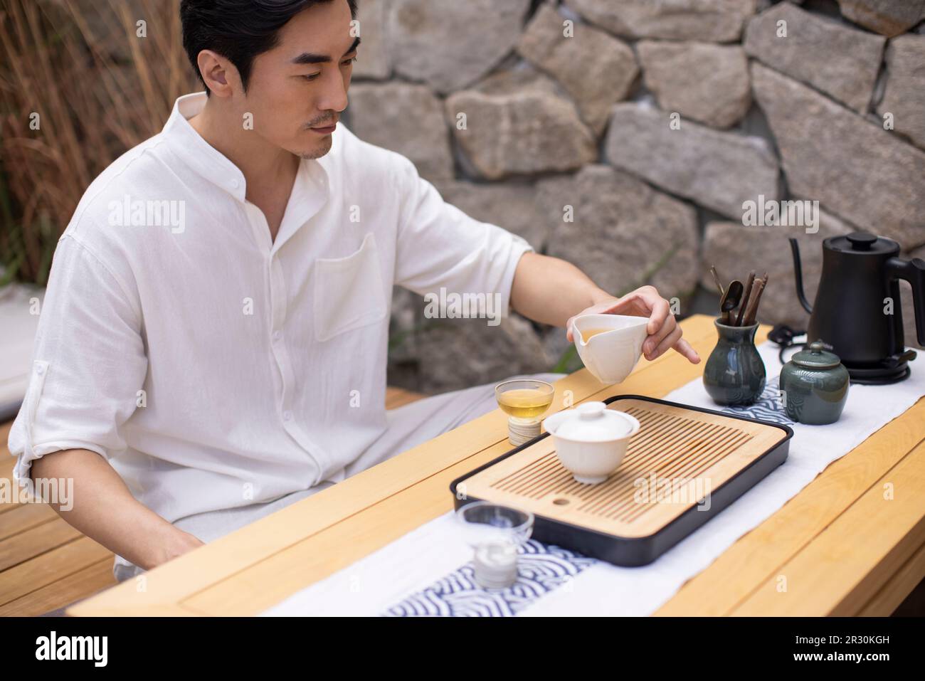 Chinese man drinking tea hi-res stock photography and images - Alamy