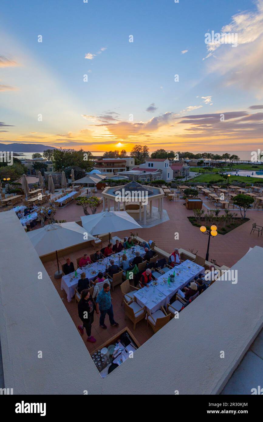 Elevated view of outdoor restaurant terrace during sunset time at the ...