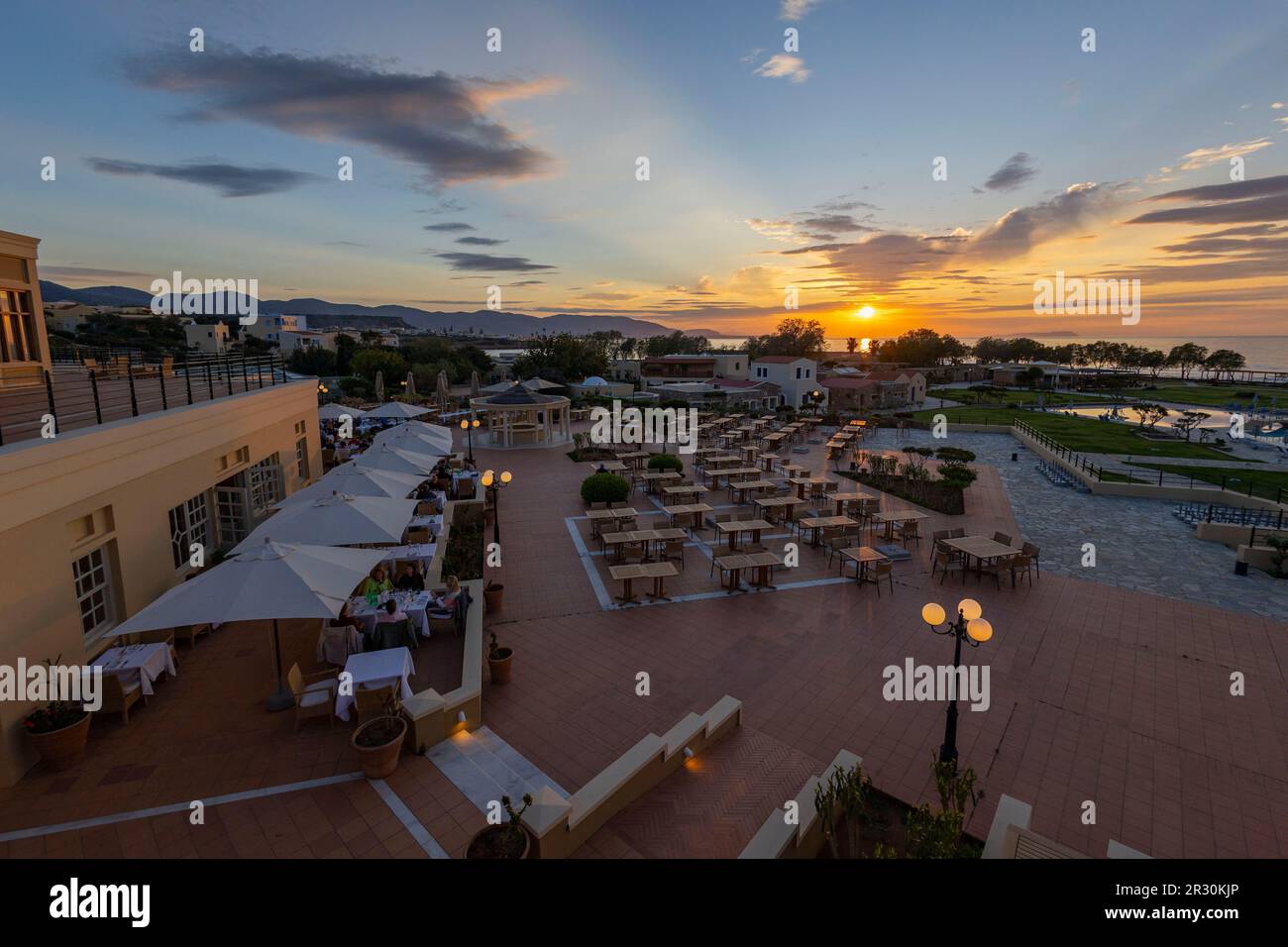 Elevated view of outdoor restaurant terrace during sunset time at the ...