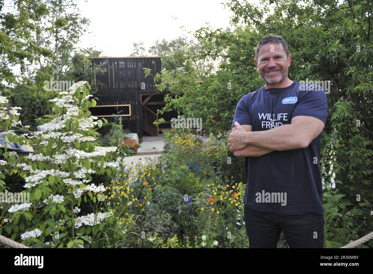 Steve Backshall (wildlife TV presenter) standing next to the RSPCA ...