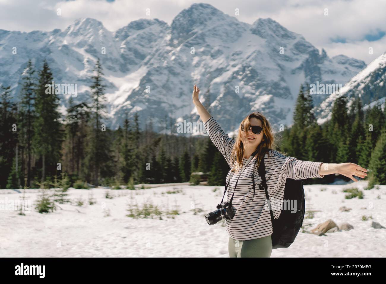Back view of a girl traveler wearing a backpack traveling alone Stock ...