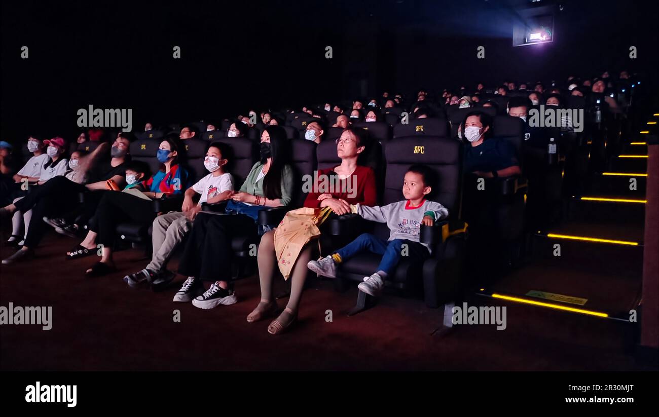 SHANGHAI, CHINA - MAY 21, 2023 - Citizens watch the classic animated ...