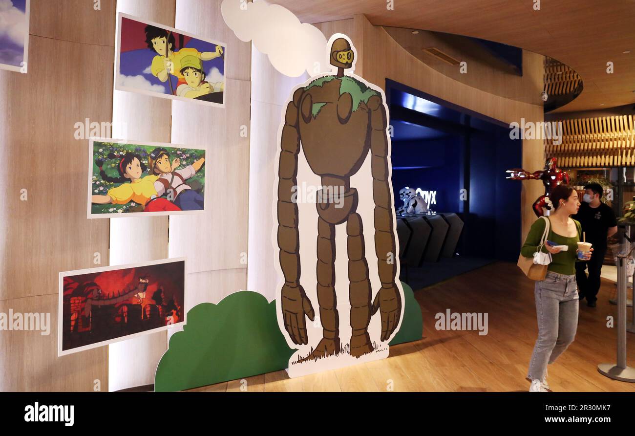 SHANGHAI, CHINA - MAY 21, 2023 - Citizens pass a poster of the classic ...