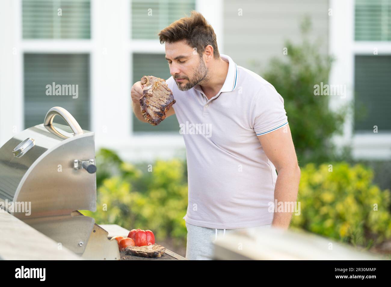 Grill chef cook. Guy with BBQ cooking tools. Barbecue and grill. Picnic ...