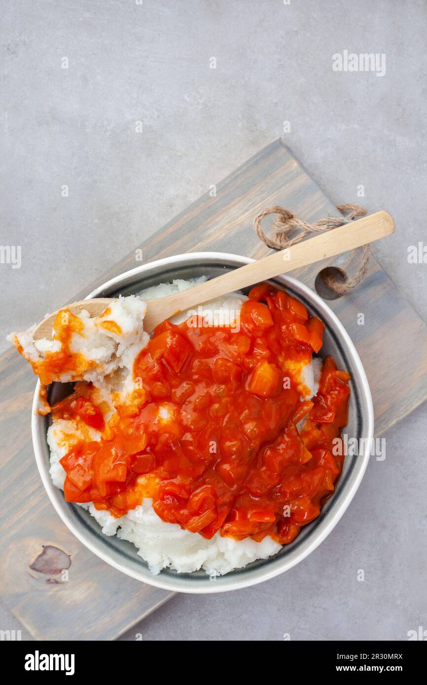 Traditional South African pap or maize meal with traditional sauce of ...