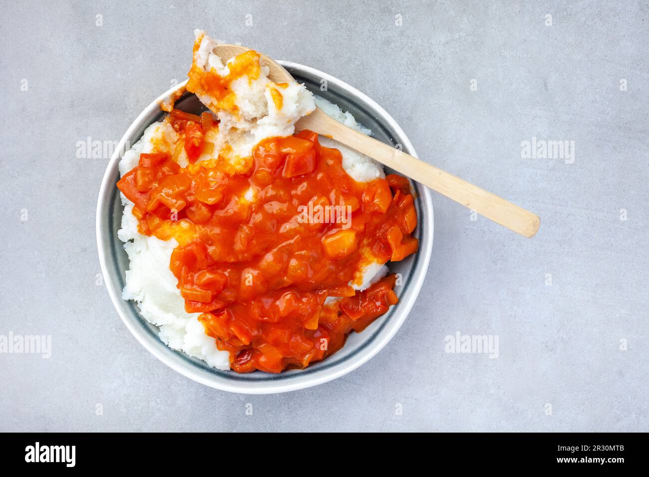 Traditional South African pap or maize meal with traditional sauce of ...