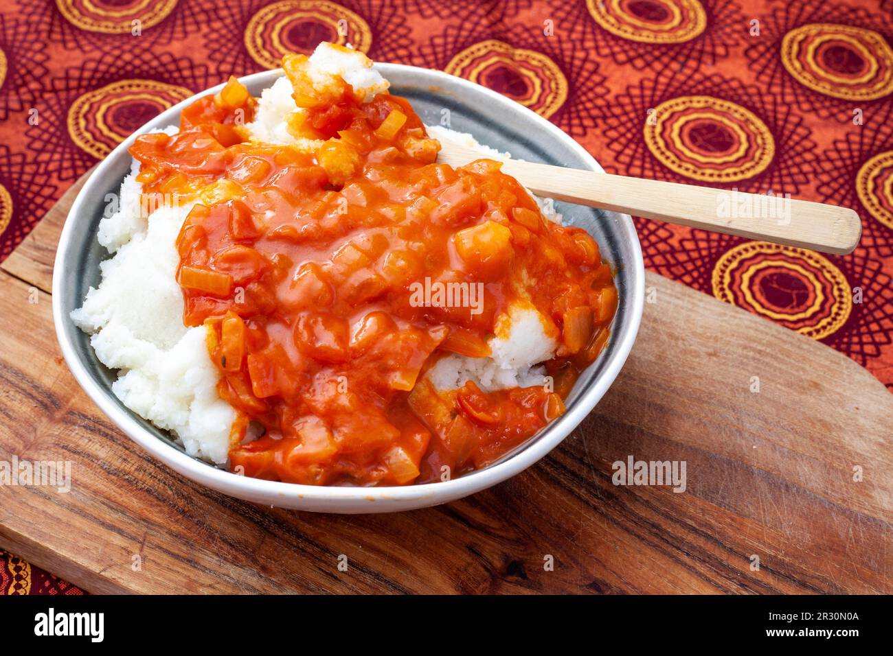 Traditional South African pap or maize meal with traditional sauce of ...