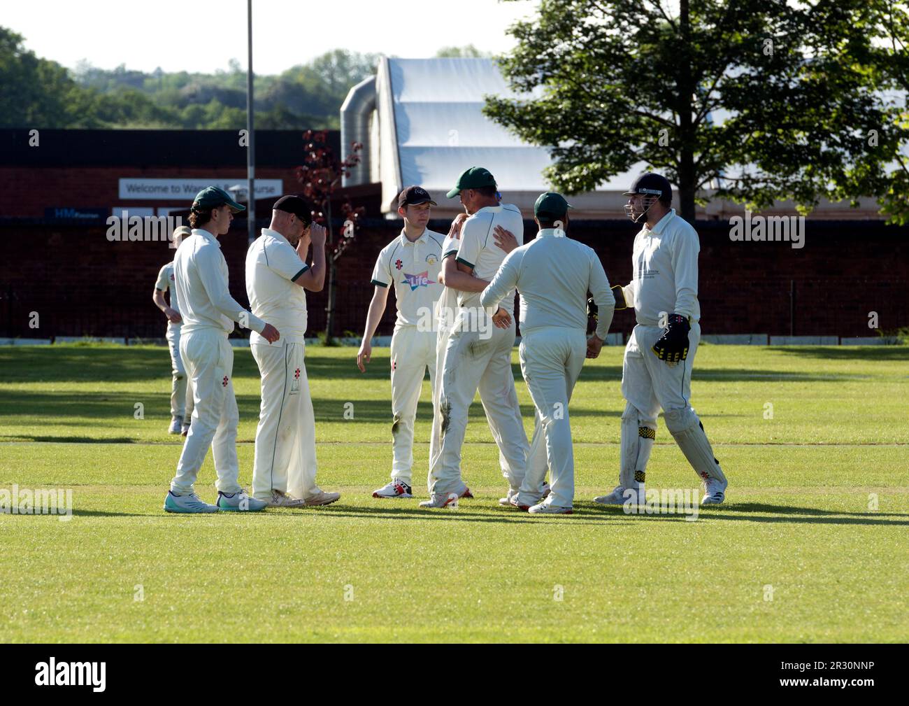 Club cricket, Warwick, England, UK. Players celebrating taking a wicket ...