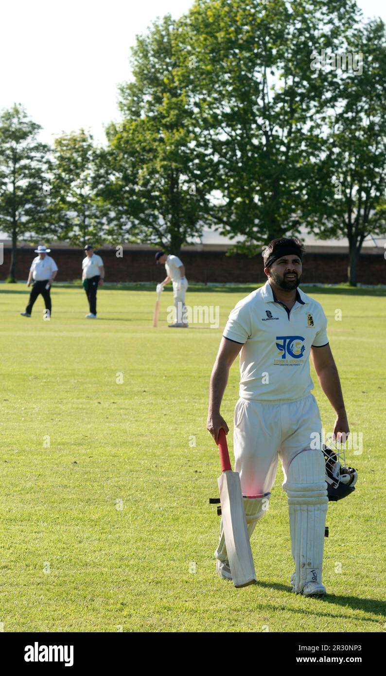 Club cricket, Warwick, England, UK. Batsman coming in after getting out ...